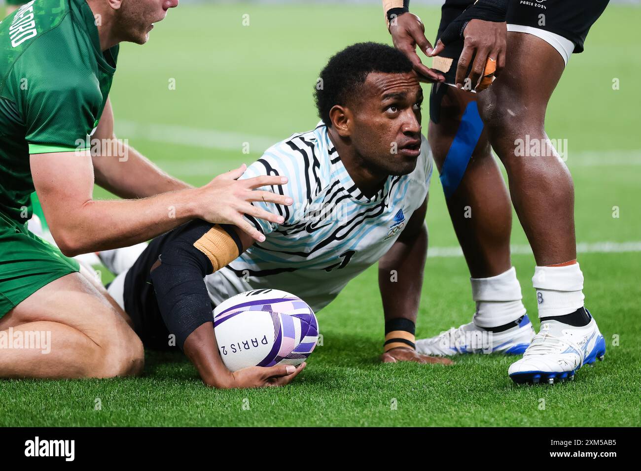 Paris, France, 25 July, 2024. Joji Nasova (1) of Team Fiji scores a try ...