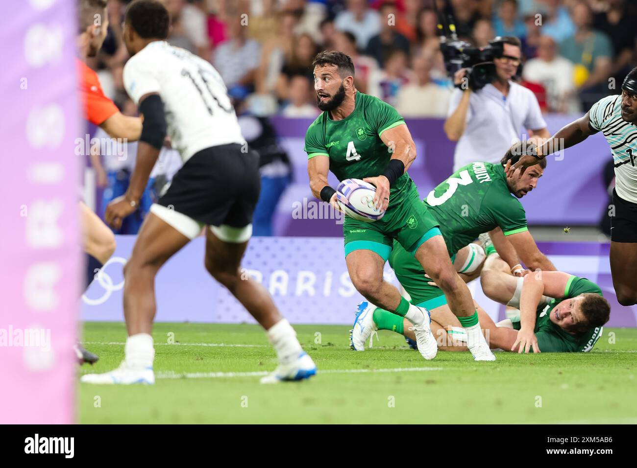 Paris, France, 25 July, 2024. Mark Roche (4) of Team Ireland runs the ...