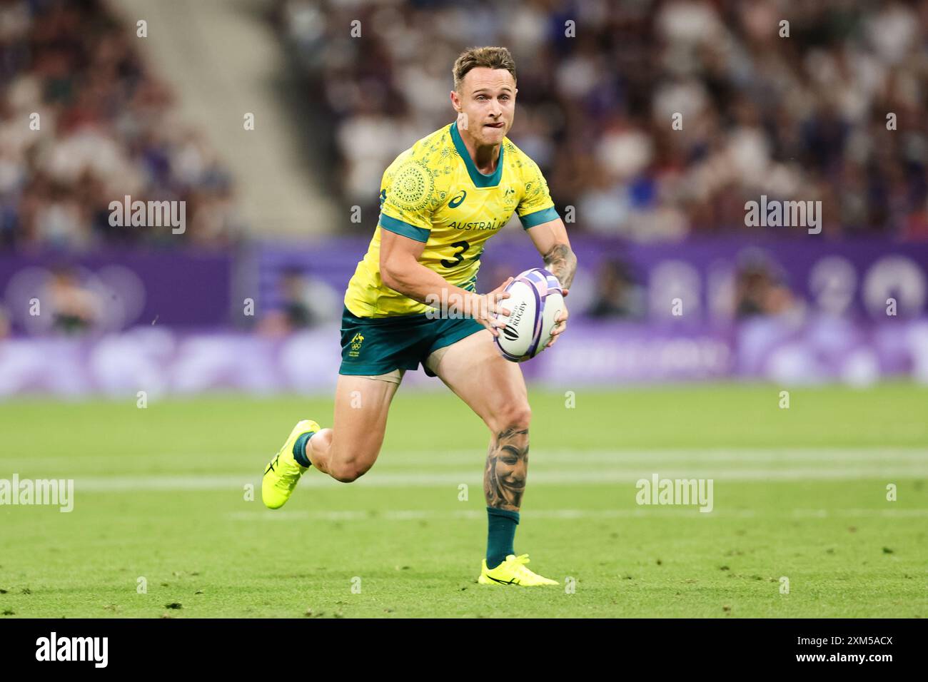 Paris, France, 25 July, 2024. Corey Toole (3) of Team Australia runs ...