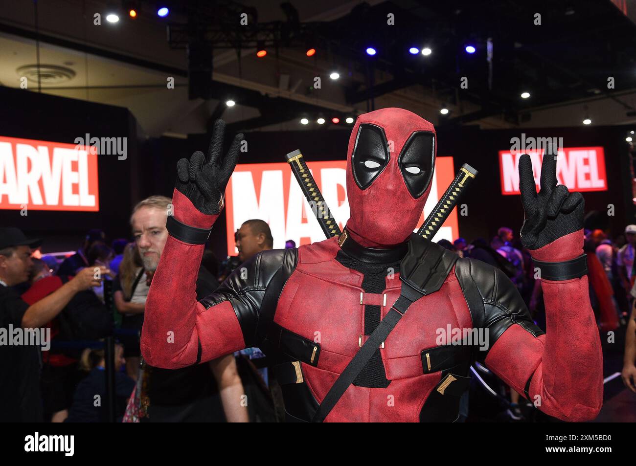 Jesus Rodriquez dressed as Deadpool poses for a photo at Comic-Con ...