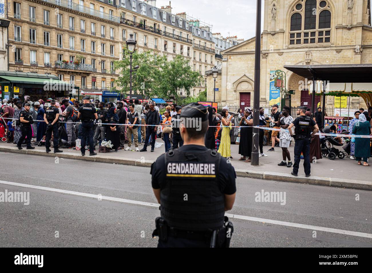 Police form a perimeter to prevent people from joining the homeless in front of the 18th ...