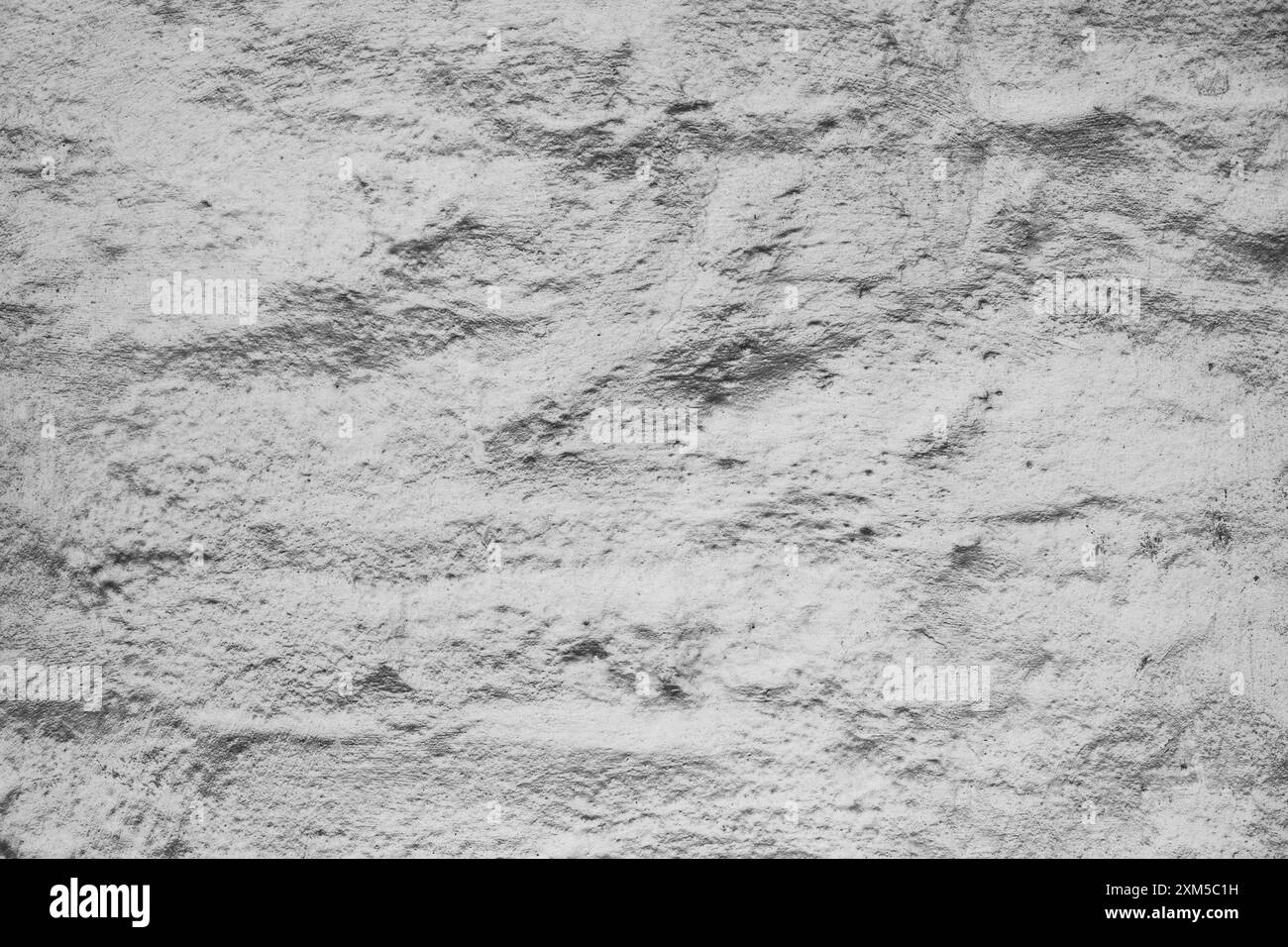 Darkened, dust-covered white plaster on the brick wall of a medieval ...