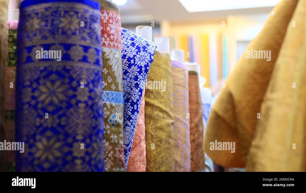 Rows of fabrics in a textile shop at Mayestik Market, Jakarta ...