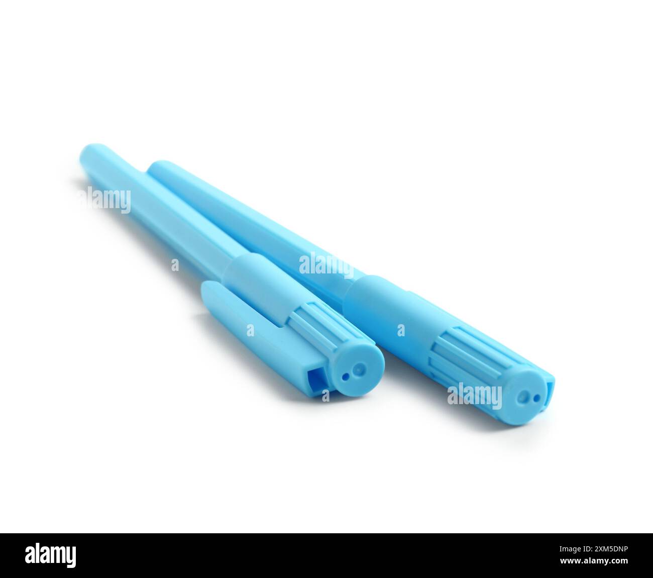 Blue ballpoint pens on white background Stock Photo - Alamy