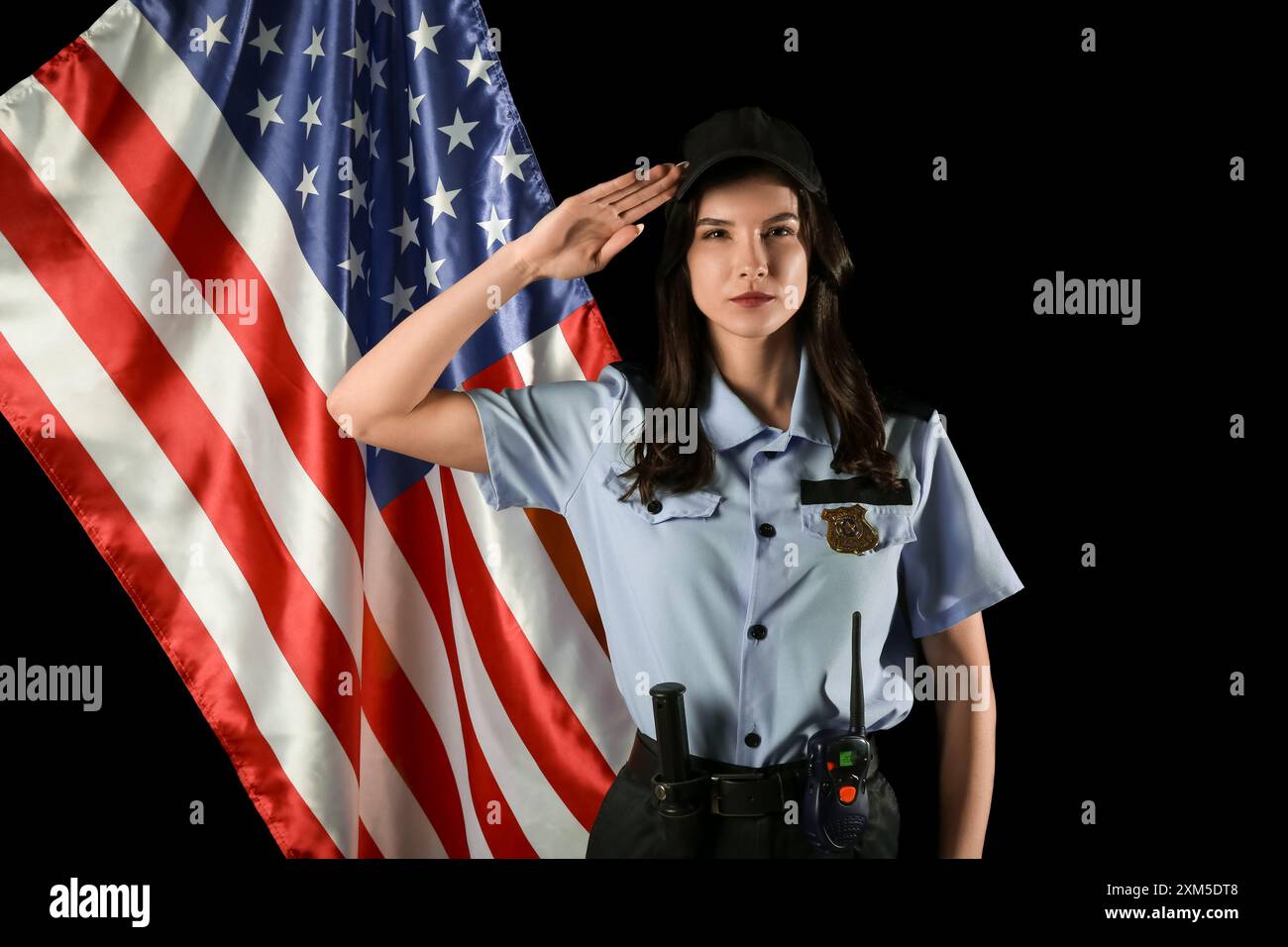 Saluting female police officer and flag of USA on black background ...