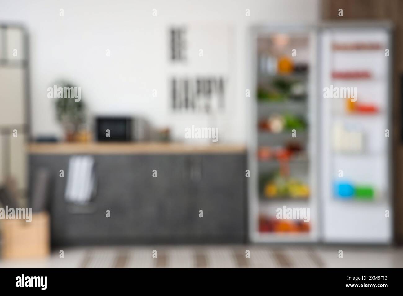 Open big fridge with fresh products in kitchen. Blurred view Stock ...