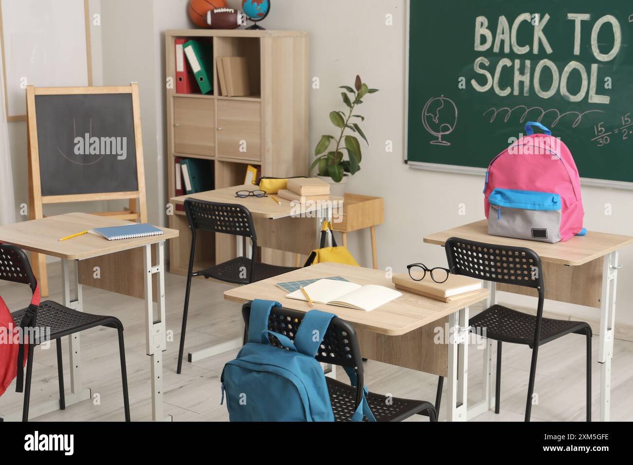 Children backpacks classroom table hi-res stock photography and images ...