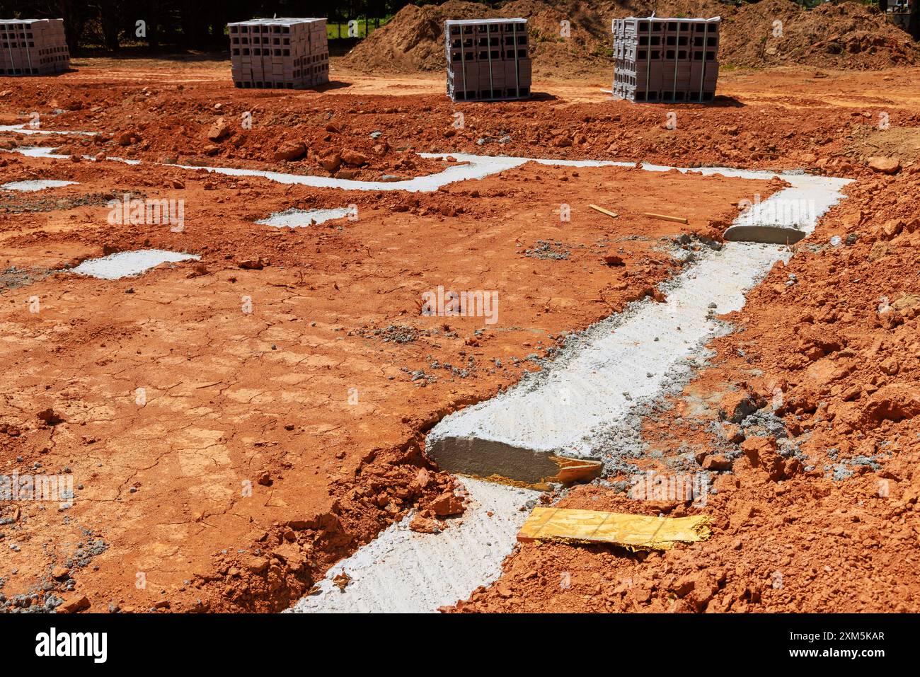 Delivery of concrete blocks to construction site with foundation for ...