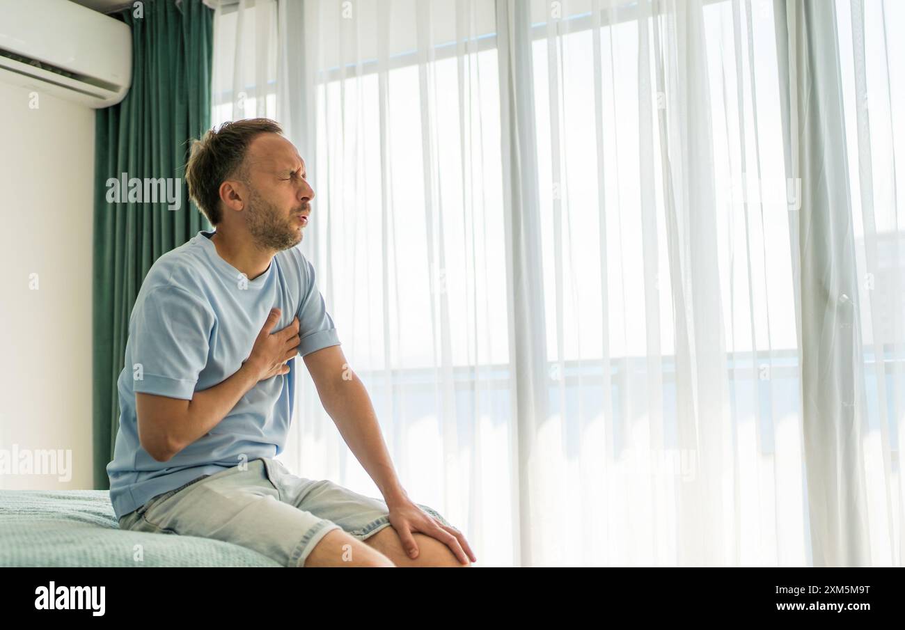 Heart attack, Man clutches his chest, indicating discomfort or pain ...