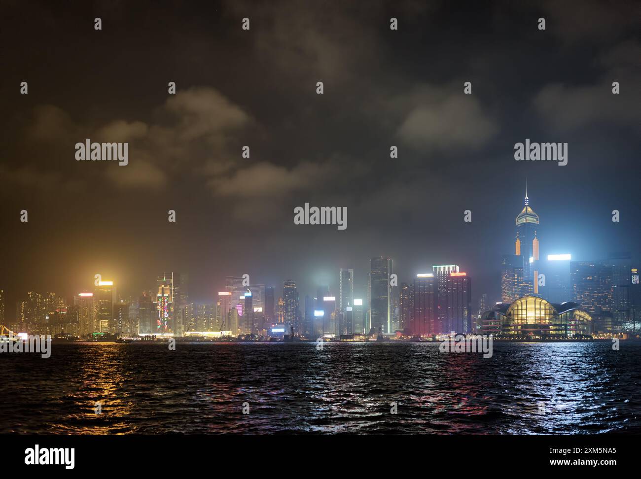 Night view of Victoria harbor and skyscrapers in business center Stock ...