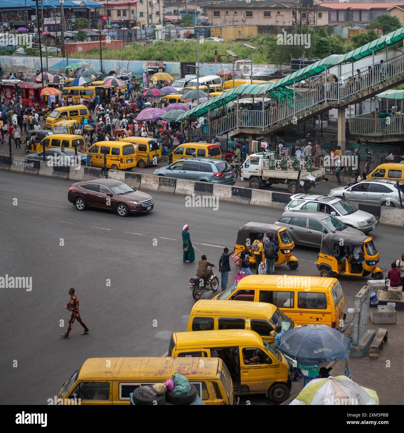 A bus park in Lagos as people find their way home after work hours ...