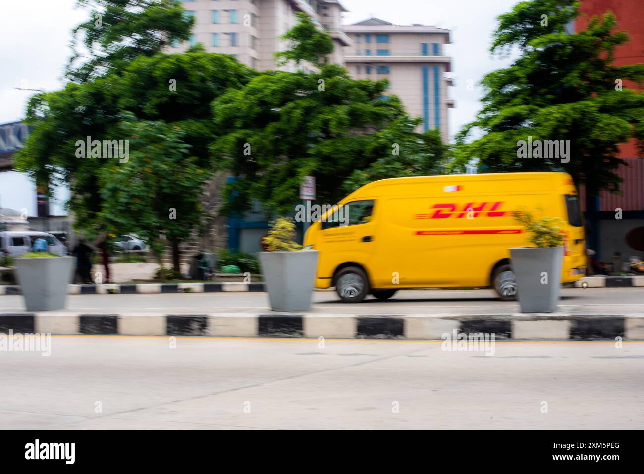 DHL branded bus in Lagos, Nigeria, July 20 2023. Fuel prices surged to ...