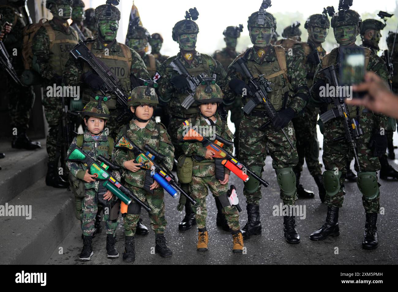 Boys dressed as soldiers pose for a photo during the Independence Day ...