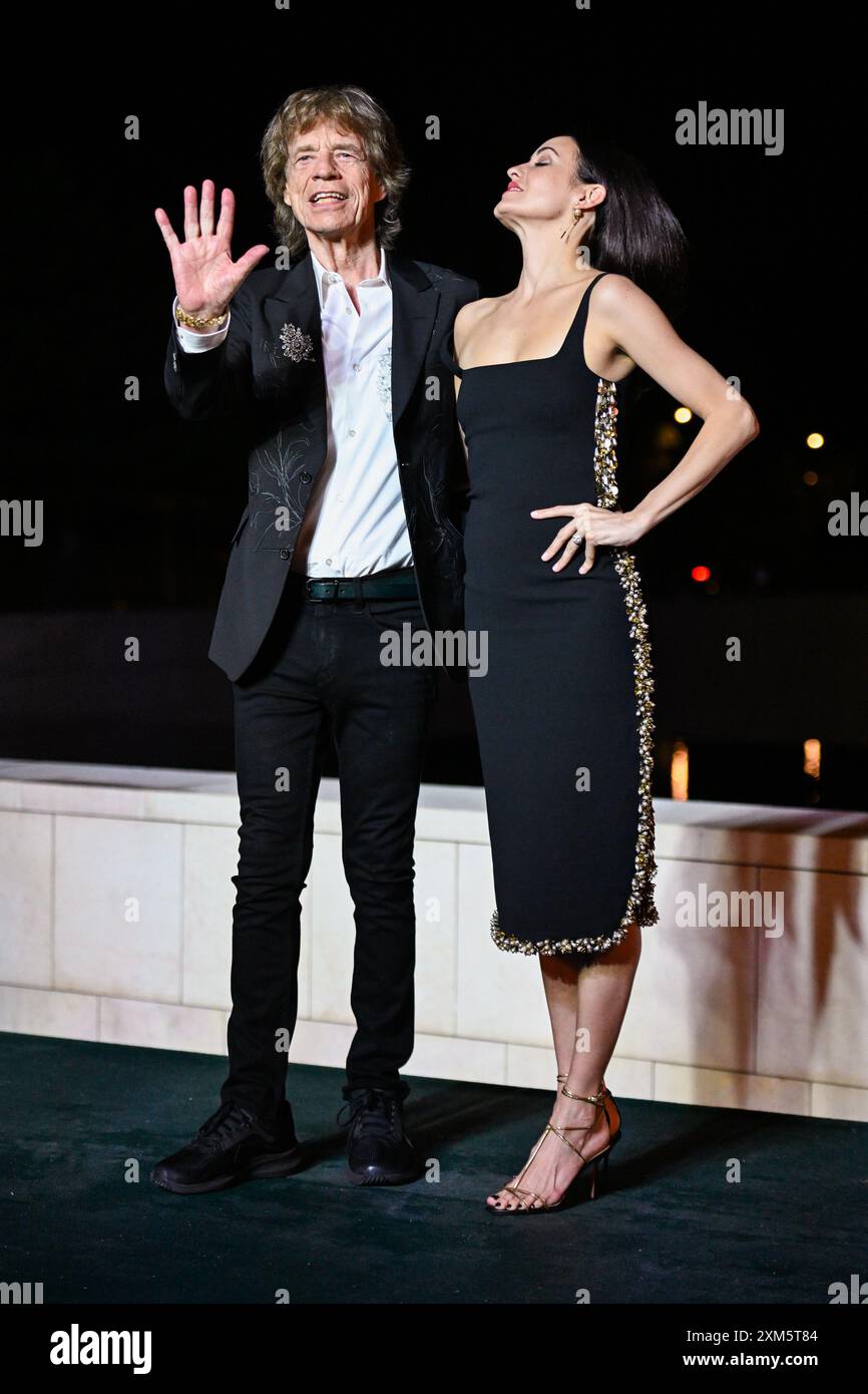 Mick Jagger and Melanie Hamrick posing for photos on the red carpet at ...
