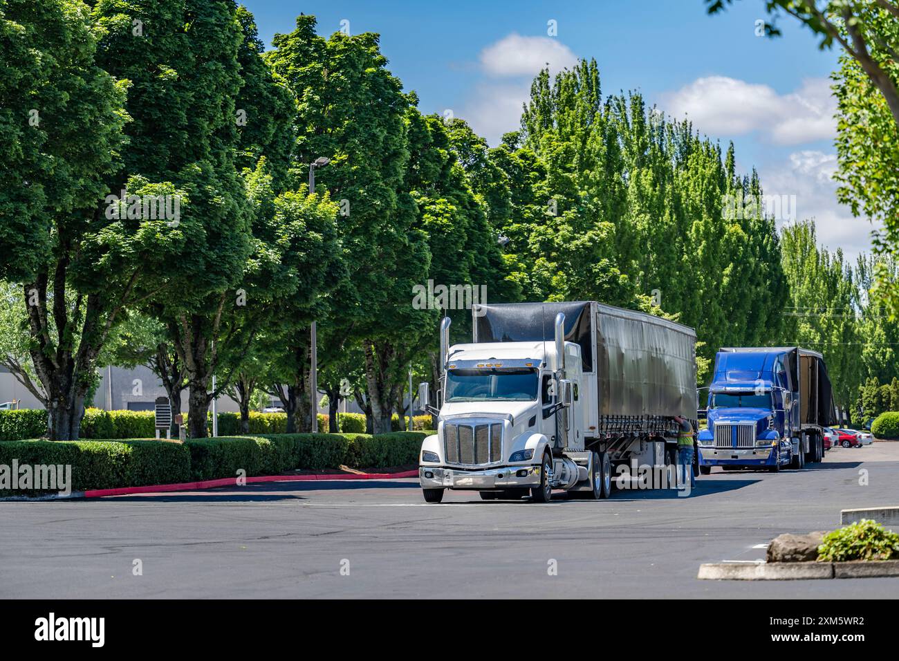 Industrial carriers blue and white big rig semi trucks with extended ...