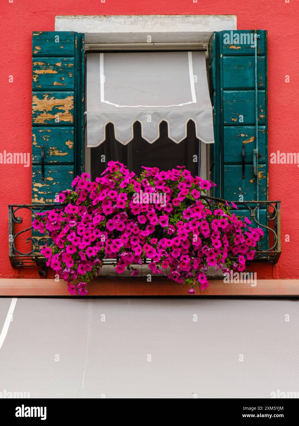 The pale red window exudes soft elegance, adding a subtle yet charming ...