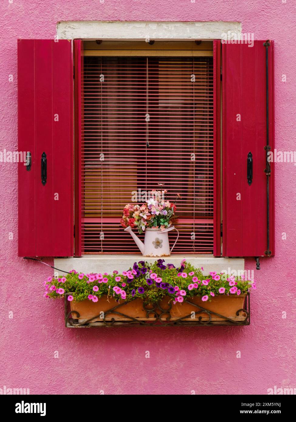 A light pink window adds a touch of delicate beauty, enhancing Burano's ...