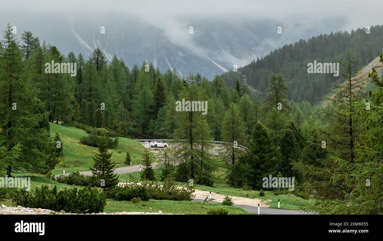 Experience the breathtaking journey along this serpentine road as it ...