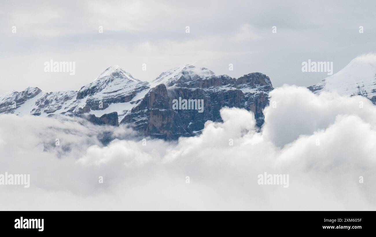 June in the Dolomites: Snow-covered mountains wrapped in the gentle ...