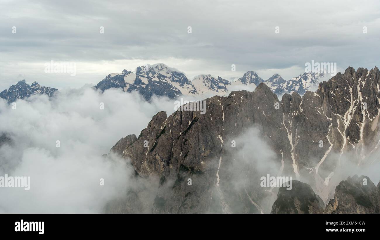 Tre Cime Circuit Trail in June: Snow and clouds mingle with Dolomite ...