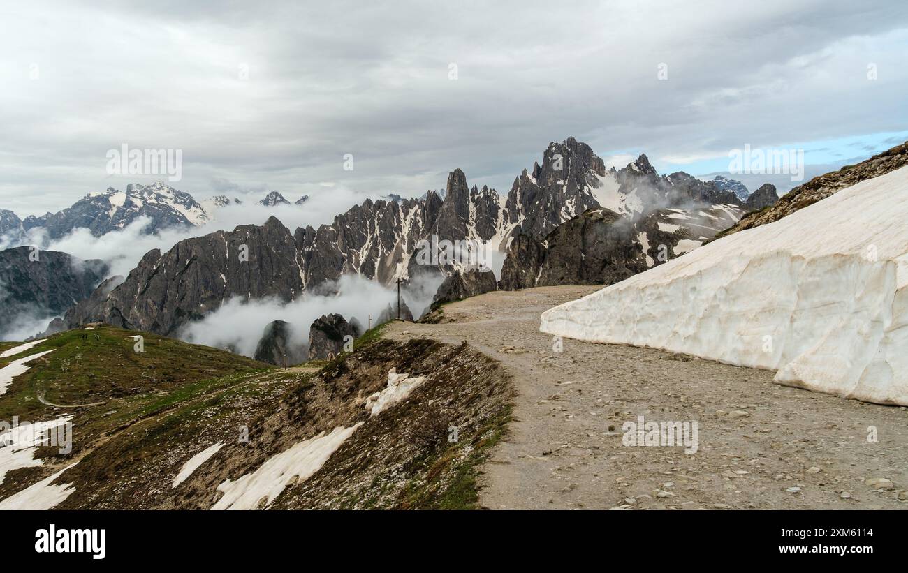 Dolomites' rugged beauty in June: Snow and fog enveloping Tre Cime ...