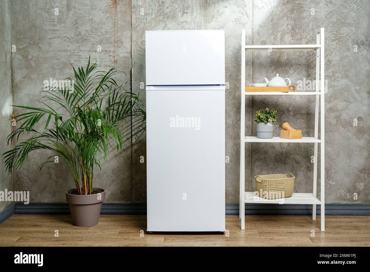 White Refrigerator Against Concrete Wall Stock Photo - Alamy