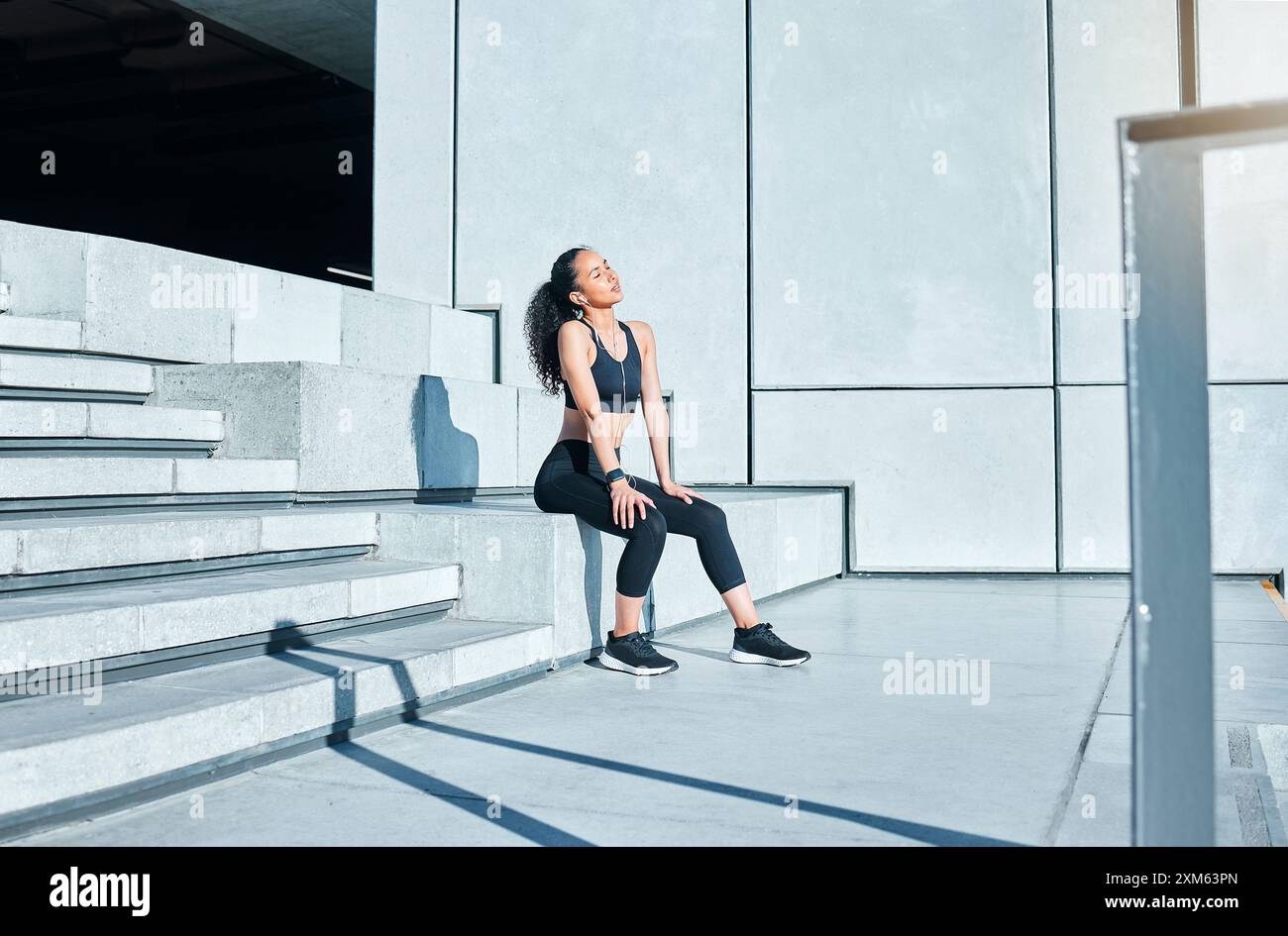 Training, break and woman on stairs for music, sports podcast and body ...