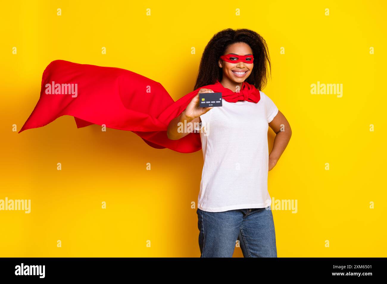 Portrait of nice young woman superhero costume show debit card isolated ...
