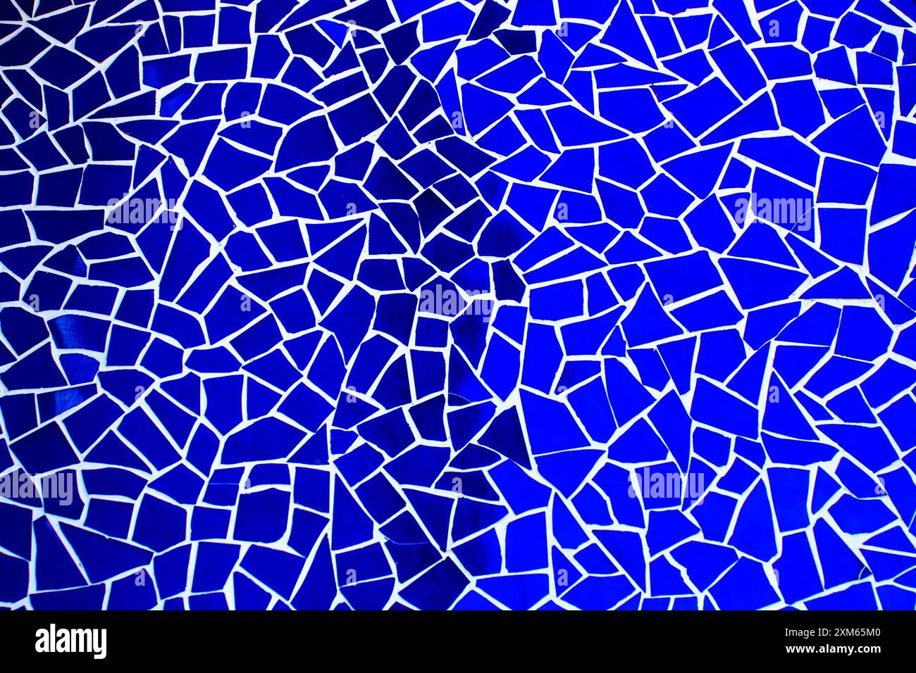 Bright blue mosaic pattern with varied tile shapes Stock Photo - Alamy