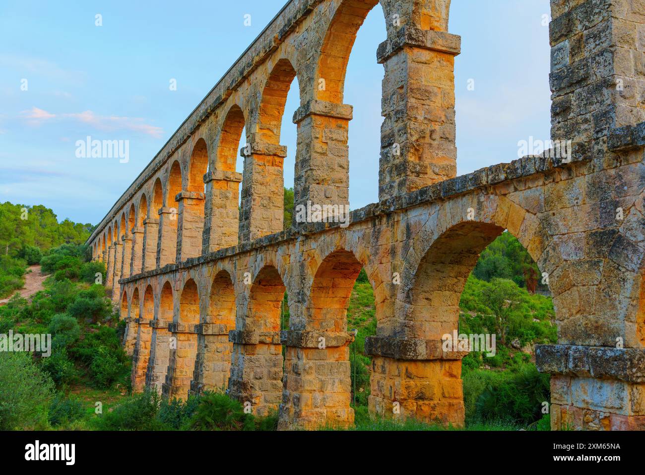 Majestic view of stunning stone arches of the Roman aqueduct surrounded ...