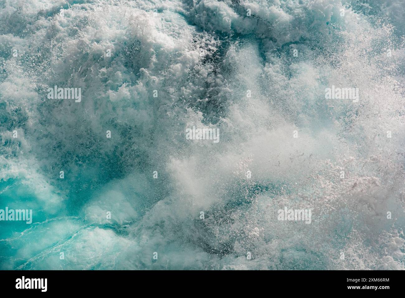 Turquoise waves crash in a dynamic display of ocean power Stock Photo ...