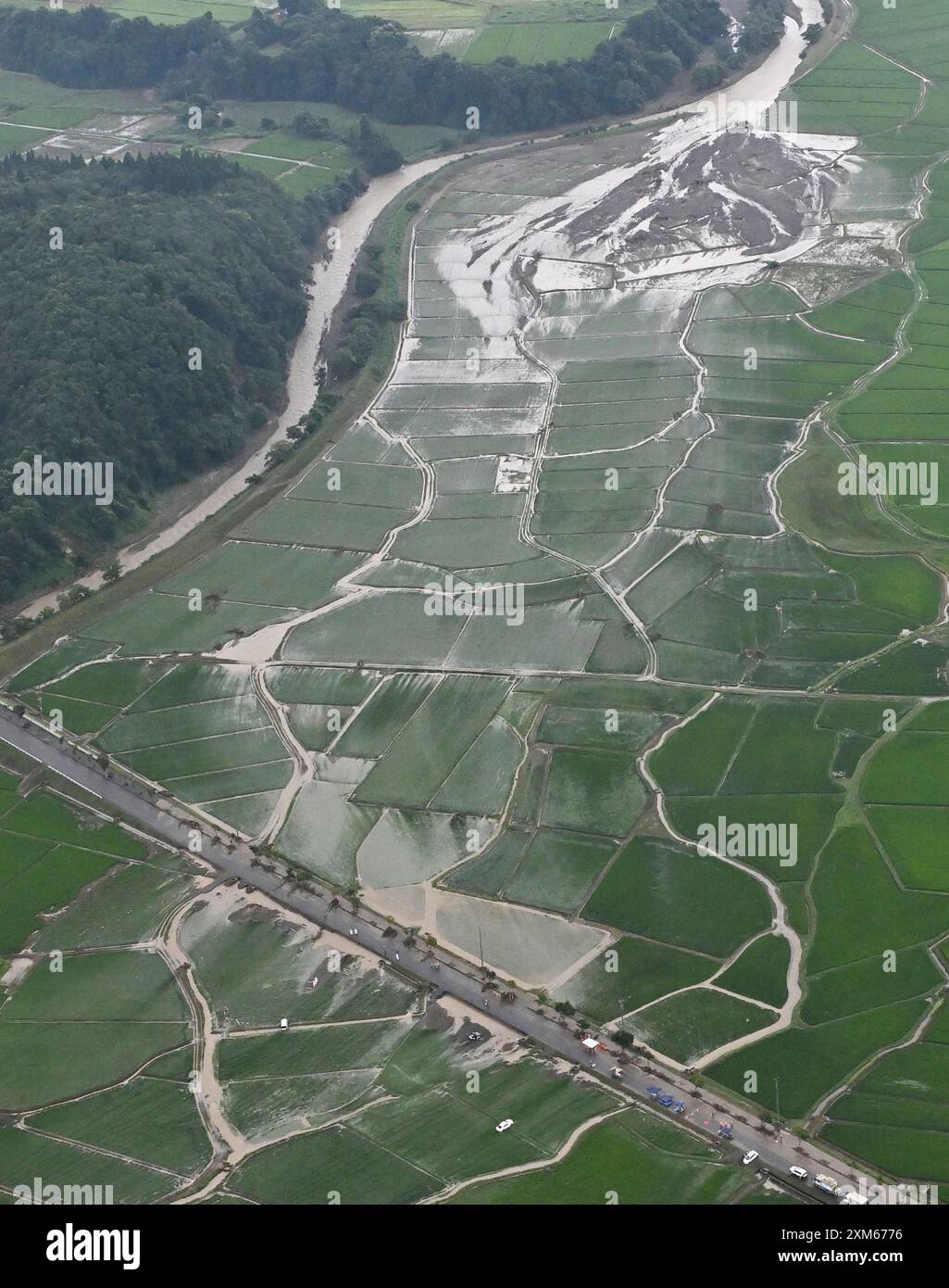 An aerial photo shows the site where a police car and cars were swept ...