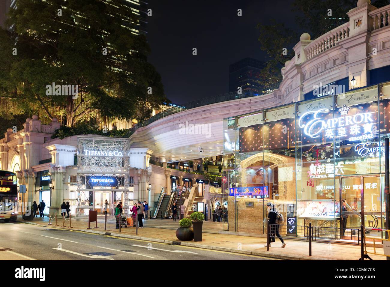Luxury elite stores on streets of night city Hong Kong Stock Photo - Alamy