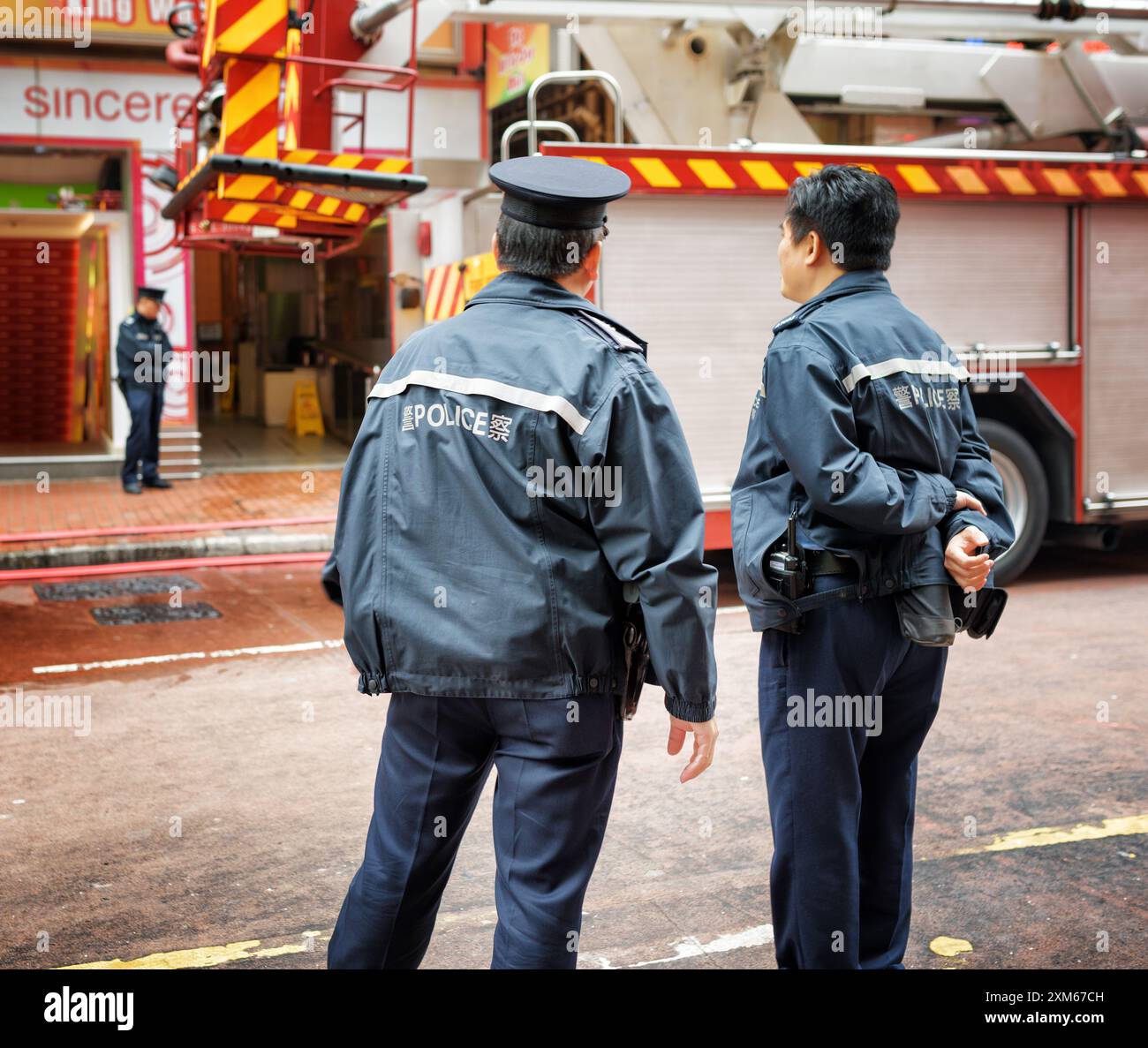 Police officers providing order near the shopping mall Stock Photo - Alamy