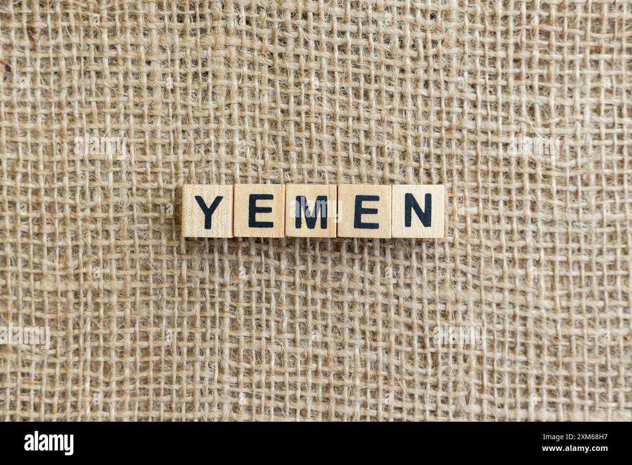 YEMEN country name made with wooden block cubes on a burlap background ...