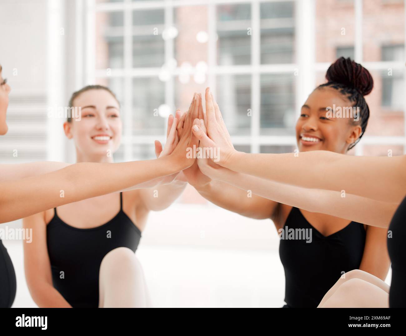 Ballet, hands and high five with people in studio together for class ...