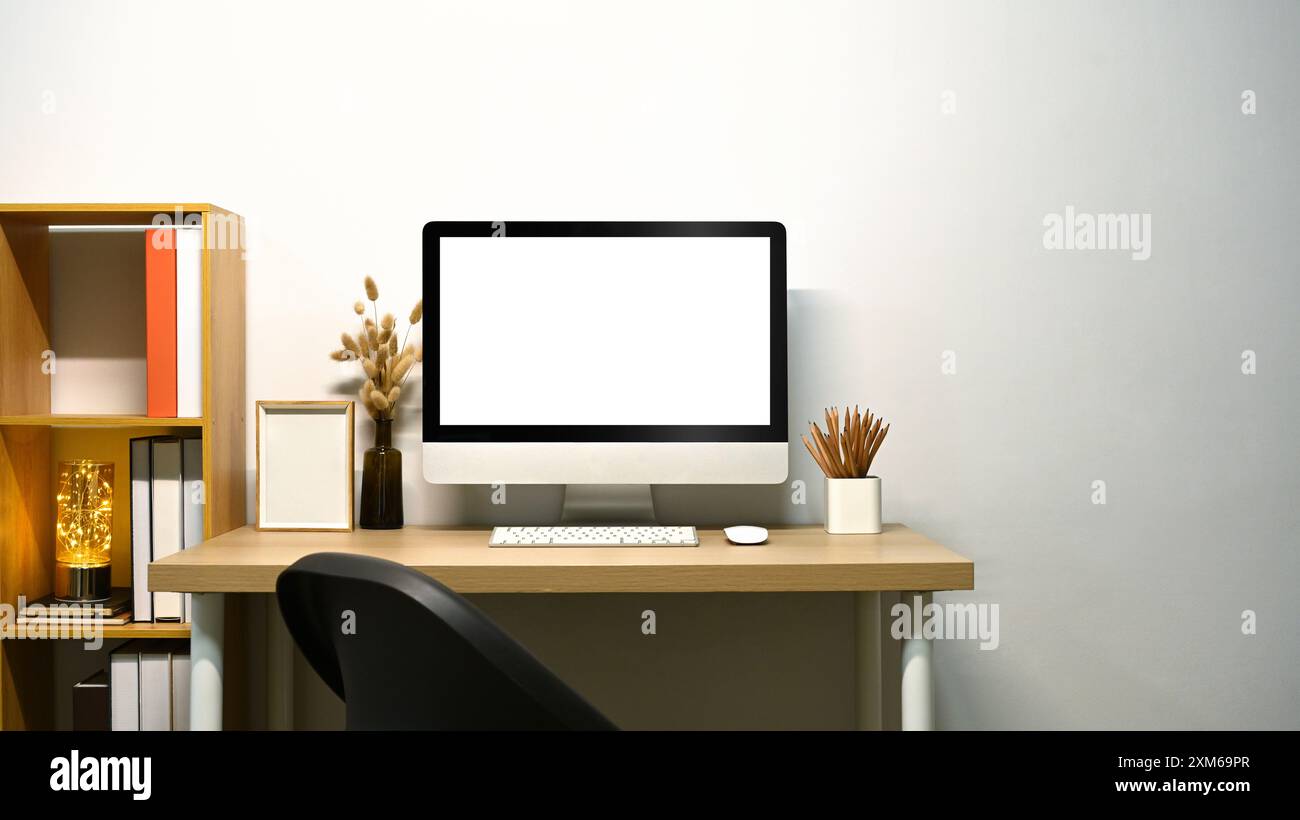 Minimalist home office, computer monitor with blank screen and wooden ...