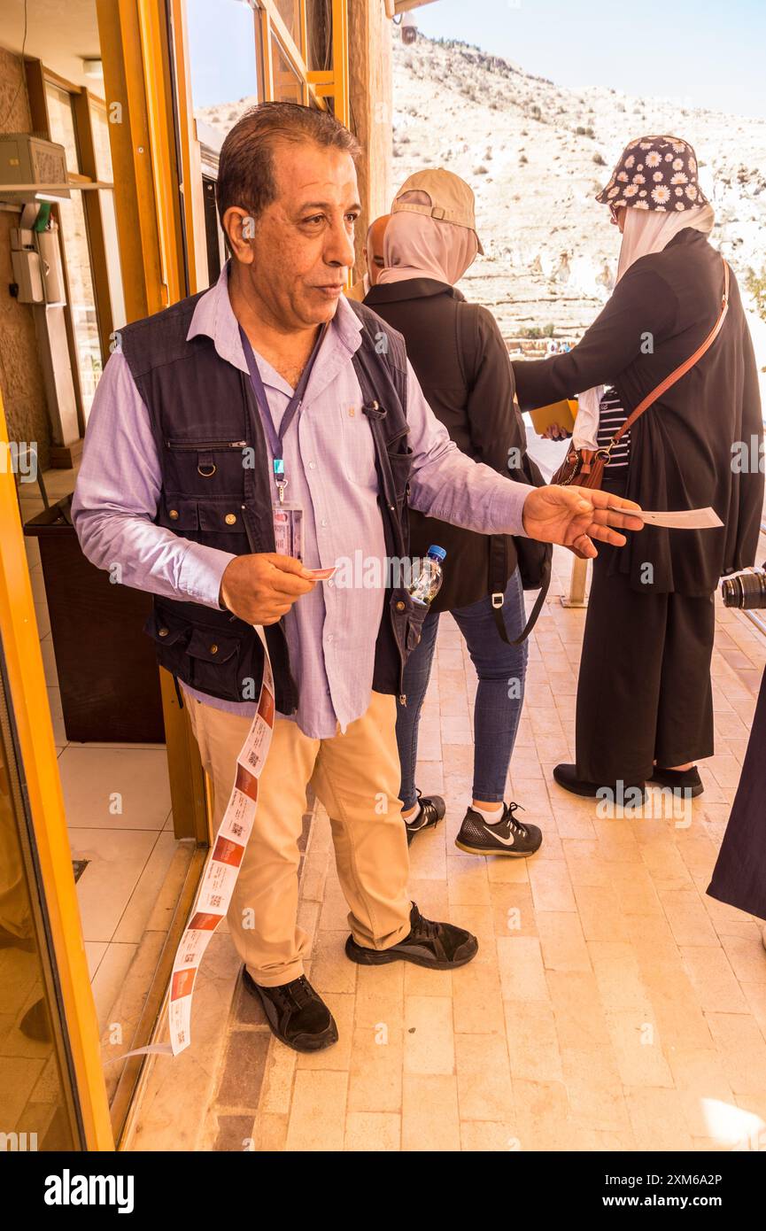 Tour guide handing out admission tickets, UNESCO World Heritage Site of ...