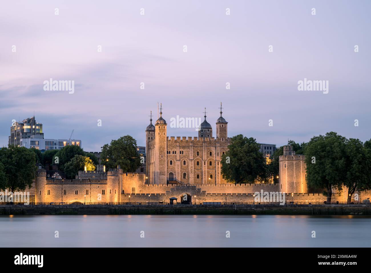 As the sun sets over the historic Tower of London, the pastel sky ...