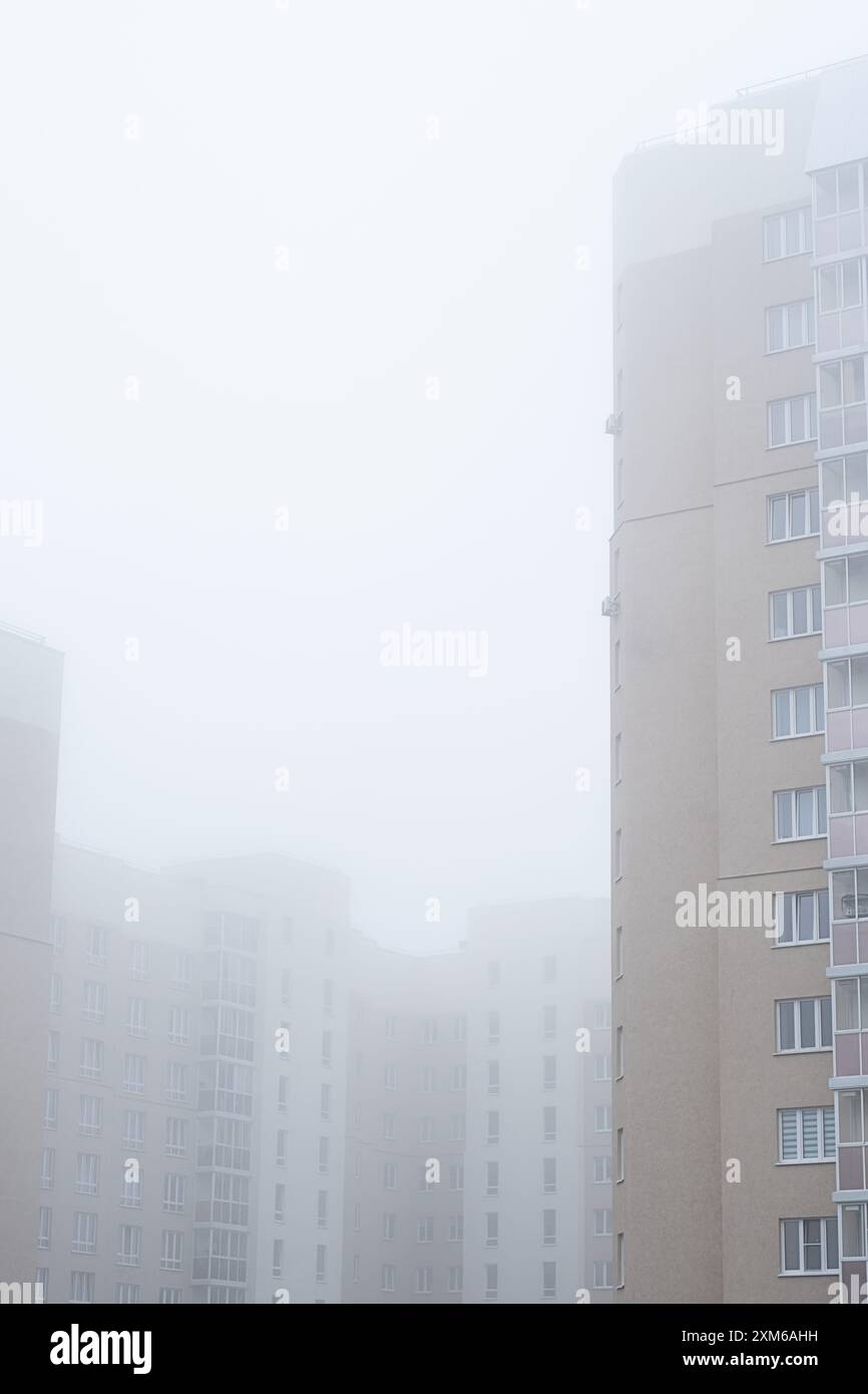Multistory apartment building during foggy morning Stock Photo - Alamy