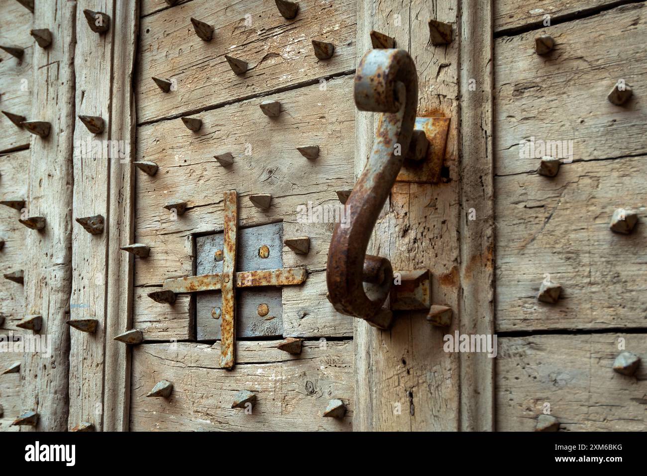 Detailed Close-Up of an Ornate Rustic Door With Spikes and Iron ...
