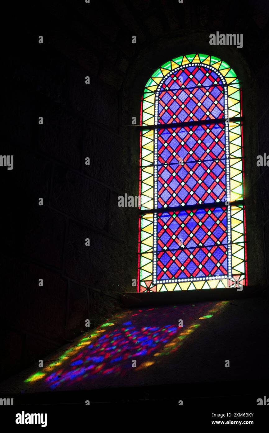 Colorful Stained Glass Window Casting Vibrant Light Patterns on Stone Wall . France Stock Photo ...