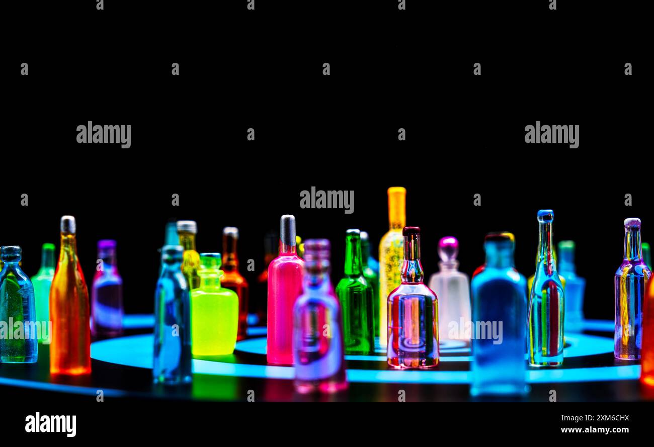 various miniature bottles of alcohol without labels with black ...