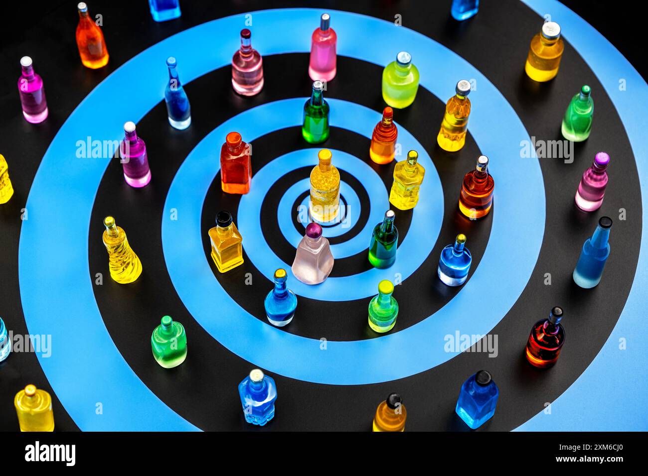 various miniature bottles of alcohol without labels on table with ...