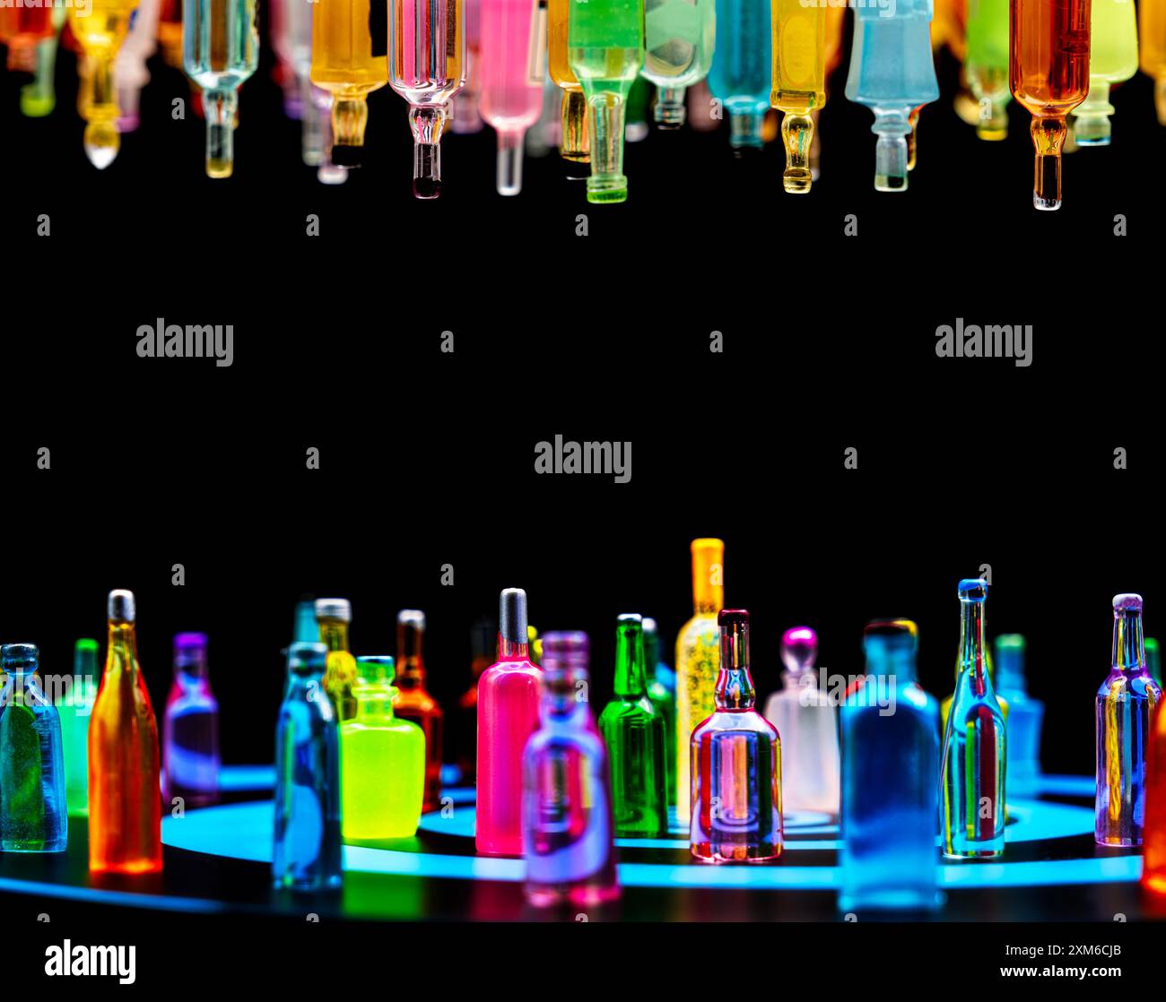 various miniature bottles of alcohol without labels with black ...