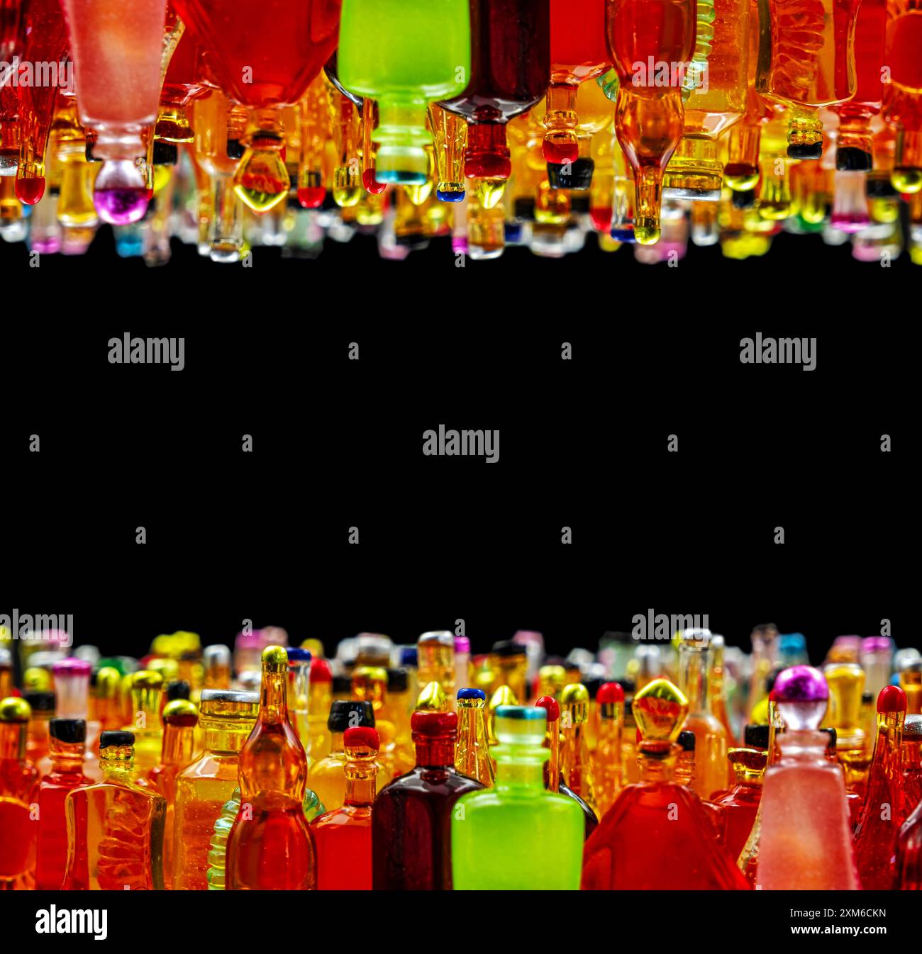 various miniature bottles of alcohol without labels with black ...