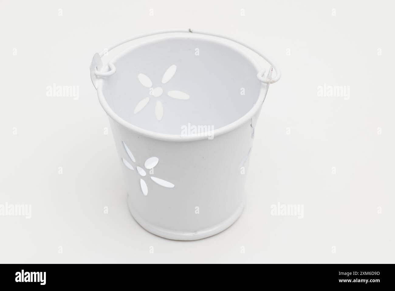 Miniature decorative bucket close-up on a white background Stock Photo ...