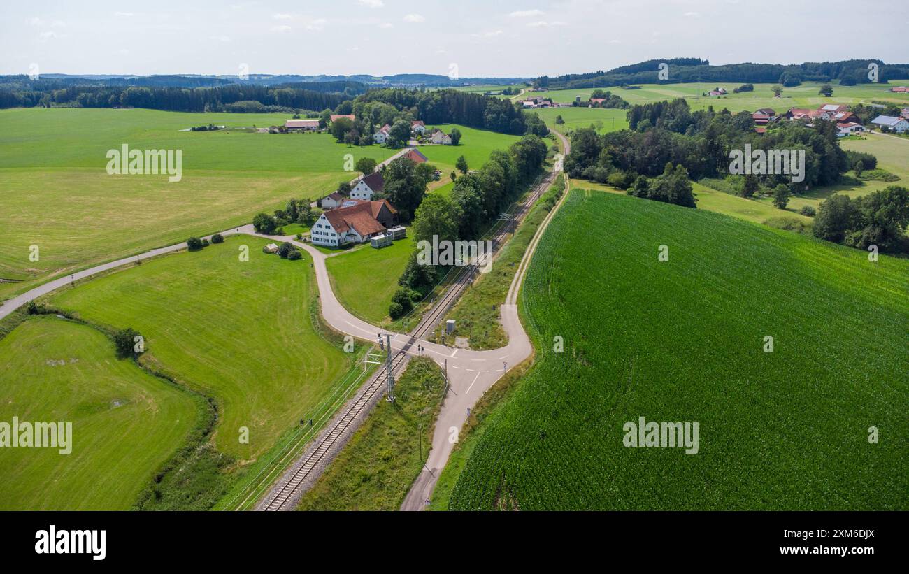 Bavaria, Germany - July 25, 2024: Aerial view of a gated level crossing ...