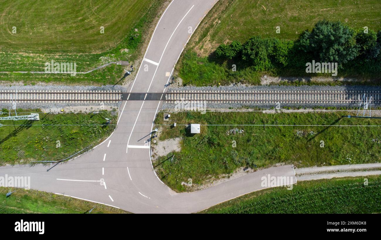 Bavaria, Germany - July 25, 2024: Aerial view of a gated level crossing ...