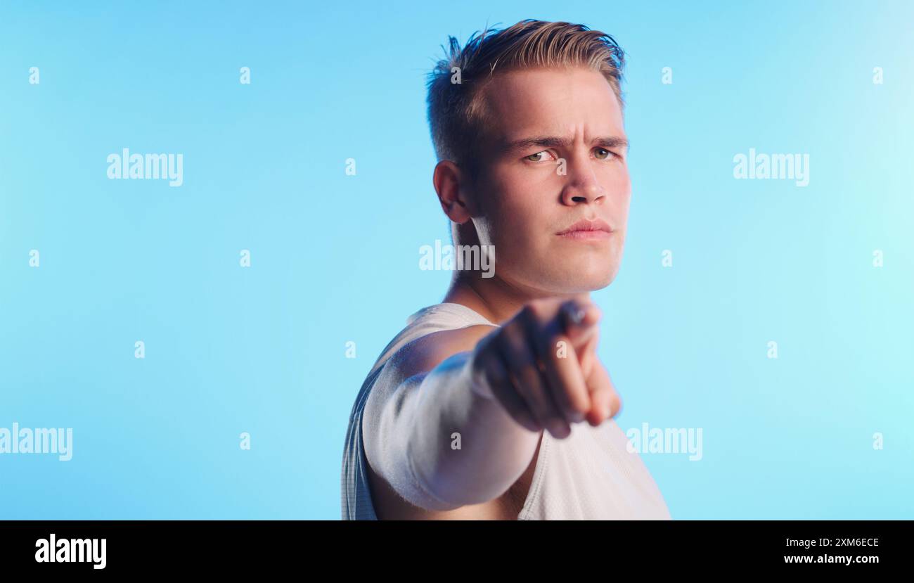 Pointing, you and man on blue background for promotion, encouragement ...